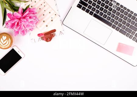 Girly office desktop with black & white laptop keyboard, pink peony ...