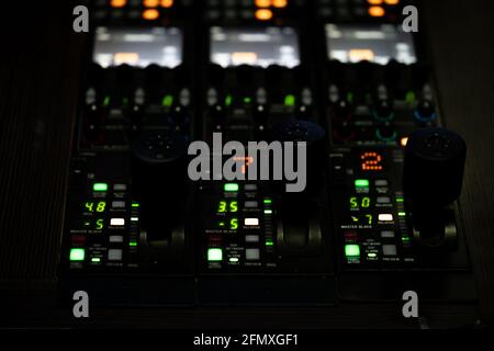Closeup of lighted mixing console isolated on black background Stock ...