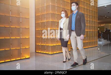 Reception wearing masks at an office building during the Coronavirus ...
