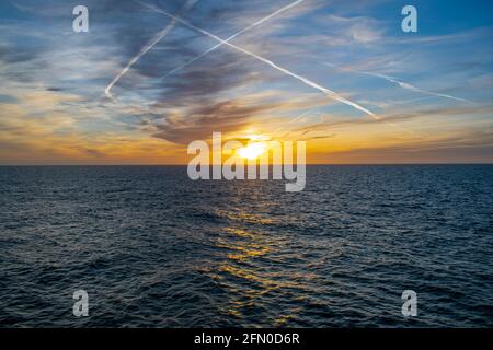 Sunset at the beach of the Hague with clouds sun in center -Den Haag ...