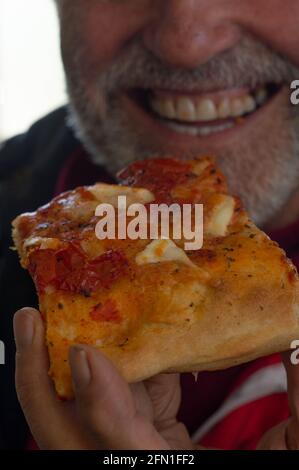 Fast food. Human mouth with red lips and the tongue as a pizza's slice ...