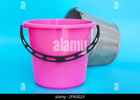 Different buckets on color background Stock Photo - Alamy