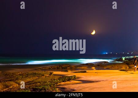 Morocco, Crescent moon above sand dune at dusk near Merzouga in Sahara ...