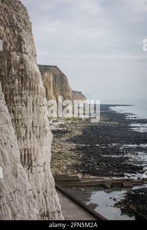 The chalk cliffs and under-cliff between Peacehaven and Newhaven in ...