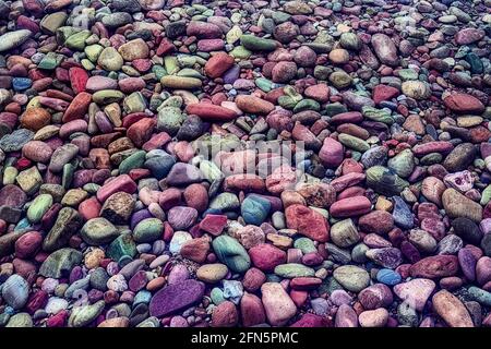 Colorful rocks on lake McDonald in Glacier National Park Stock Photo ...