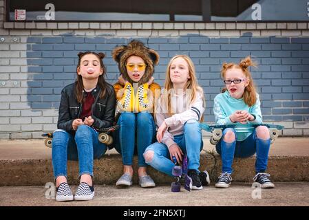 Group of 6 cute Tween girls hanging out having fun in the city Stock ...