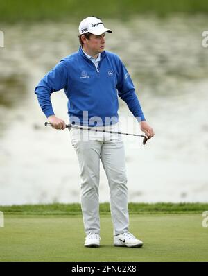 Scotland's Robert Macintyre reacts on the 18th green during day four of ...