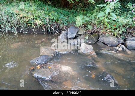 Closeup of rough river water surface with water splashes in neo mint ...
