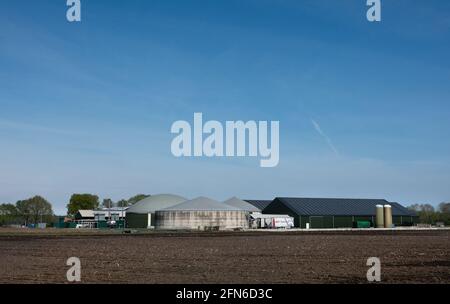 The field of solar panels with an energy storage station located in the ...