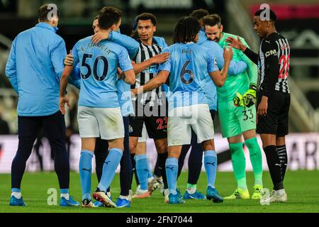 Newcastle United and Manchester City players shake hands at the full ...