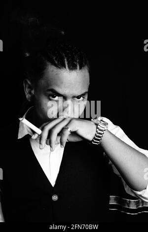Cool and handsome mob smoking cigarette in grayscale Stock Photo - Alamy