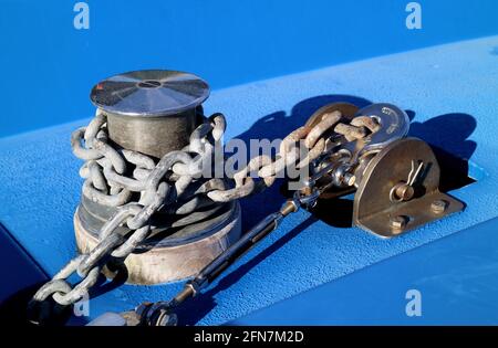 Closeup shot of a thick rusty metal chain over a fence gate outdoors ...