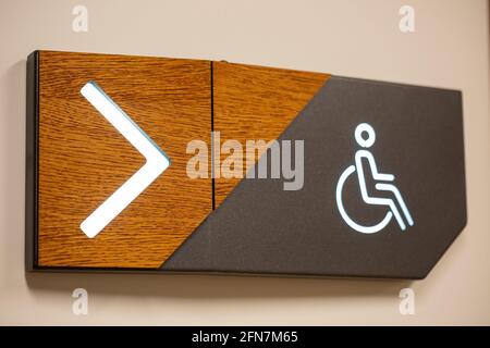 Closeup of comfort room signage with an arrow sign showing the ...