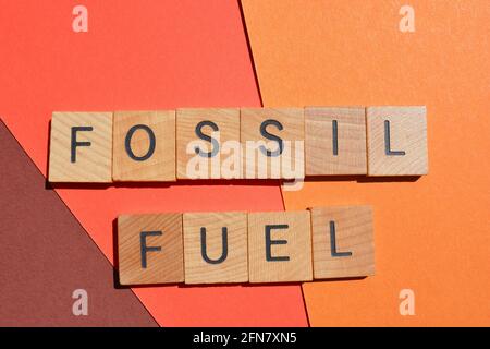 Fossil Fuels, words in wooden alphabet letters isolated on background ...