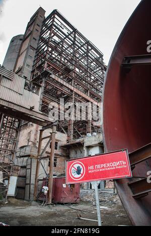 Old outdated Soviet cement plant obsolescent cement silos (towers ...