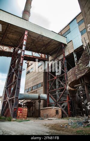 Old outdated Soviet cement plant obsolescent cement silos (towers ...