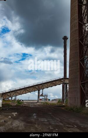 Old outdated Soviet cement plant obsolescent cement silos (towers ...