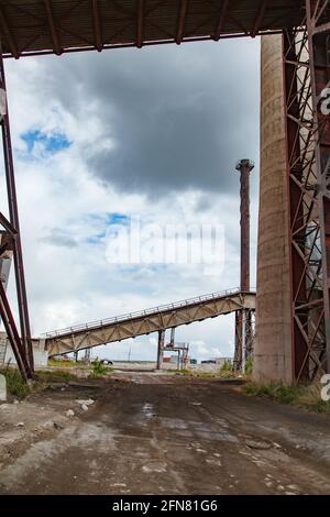 Old outdated Soviet cement plant obsolescent cement silos (towers ...