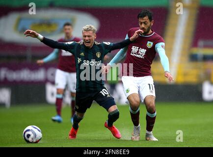 Burnley's Dwight McNeil (left) and Leeds United's Raphinha (right ...