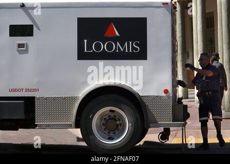 A Loomis armored truck makes a money delivery to a bank in Santa Fe ...