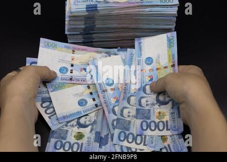 A pile of one thousand Philippines banknotes. Cash of Thousand dollar ...