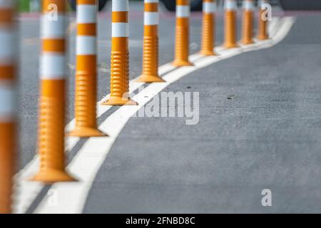 Flexible traffic bollard for bike lane Stock Photo - Alamy