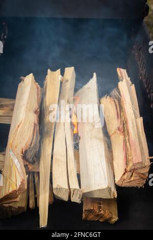 Dry wood in the grill for kindling and making coals Stock Photo - Alamy