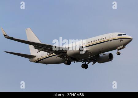 A US Navy Boeing C40A Clipper military transport aircraft flying near ...