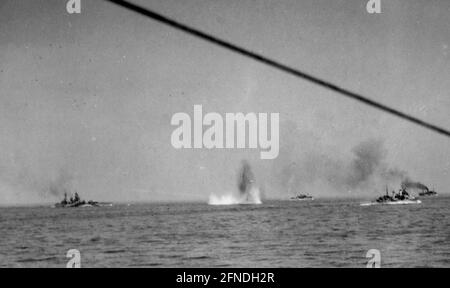 British battleship HMS Rodney of the Royal Navy firing her secondary ...
