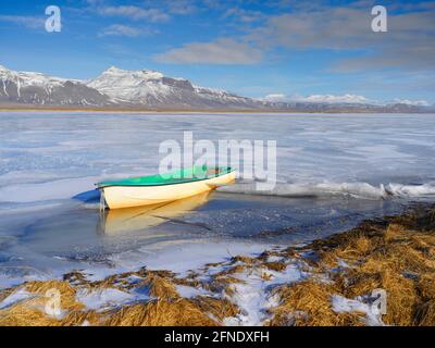 Rowing boat frozen in the ice Stock Photo - Alamy