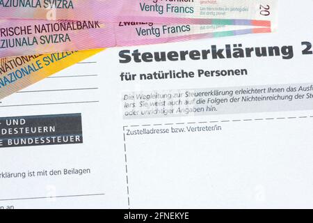 Swiss francs and tax return in Switzerland Stock Photo - Alamy