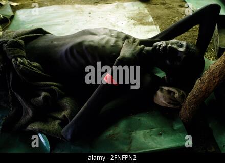SDN , SUDAN : A starving young man in Lafon ( South Sudan ) , August ...