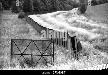 The inner German border with wall, border fence and guard tower between ...