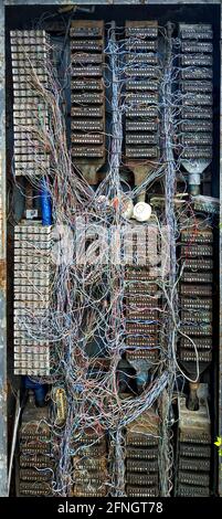 Old analog telephone switchboard system connection panel with wire ...