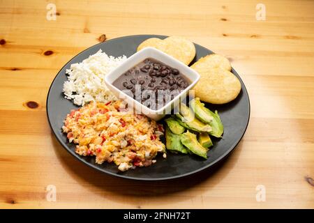 Venezuelan breakfast with eggs, arepas and beans Stock Photo - Alamy