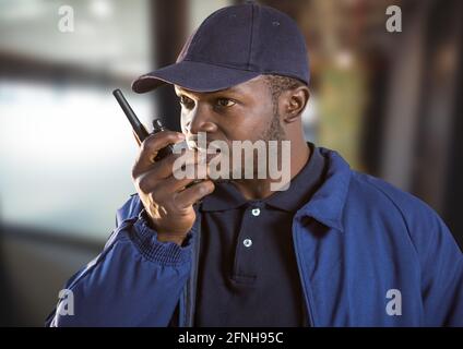 Security Guard Using Walkie-talkie Stock Photo - Alamy
