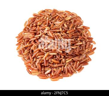 Lot of whole raw red rice with wooden bowl isolated on white background ...