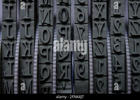 Rolling rubber stamp letters and numbers macro shot Stock Photo - Alamy