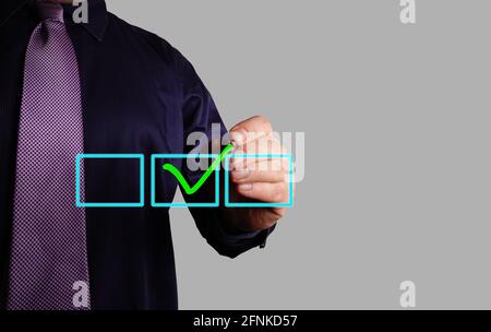 Businessman ticking off all boxes on a checklist Stock Photo - Alamy