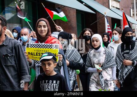 Palestinian Muslims walk through an Israeli checkpoint on the outskirts ...