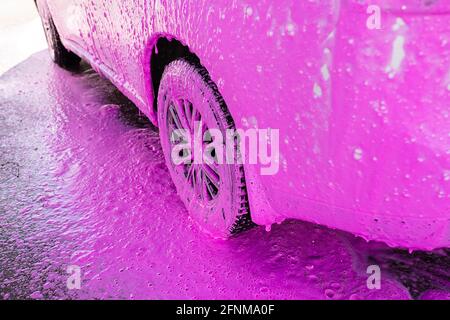 Cleaning, car wash, pink foam background stock photo Stock Photo - Alamy