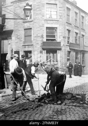 Paving Cheapside, Lancaster, with wooden blocks, possibly to reduce ...