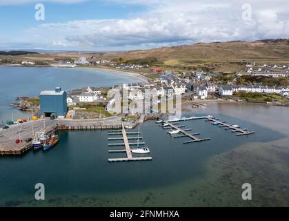Aerial view of houses overlooking Leodamais Bay in Islay village of ...