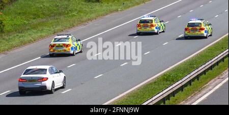 Several police cars and vehicles blocking road Stock Photo - Alamy