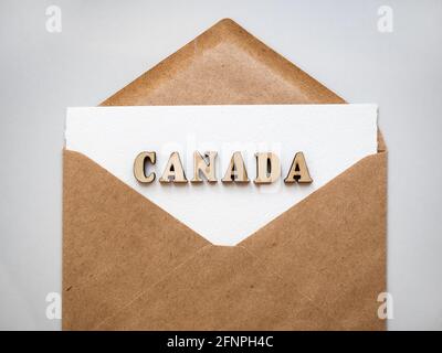 Happy Canadian Day. Postal envelope painted in the national colors of ...