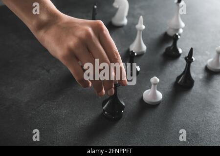 Woman playing chess on dark background Stock Photo - Alamy