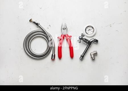 Set of plumber's items on light background Stock Photo - Alamy