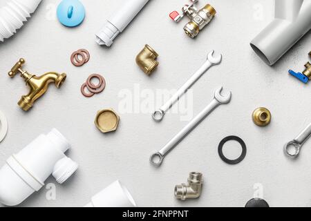 Set of plumber's items on light blue background, top view Stock Photo ...