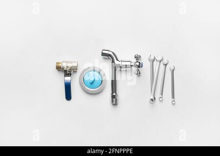 Set of plumber's items on light background Stock Photo - Alamy
