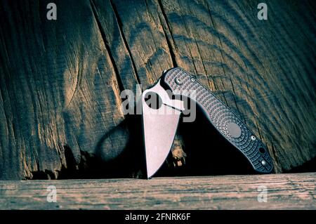 Folding knife in a bent position. Knife with clip for wearing Stock ...